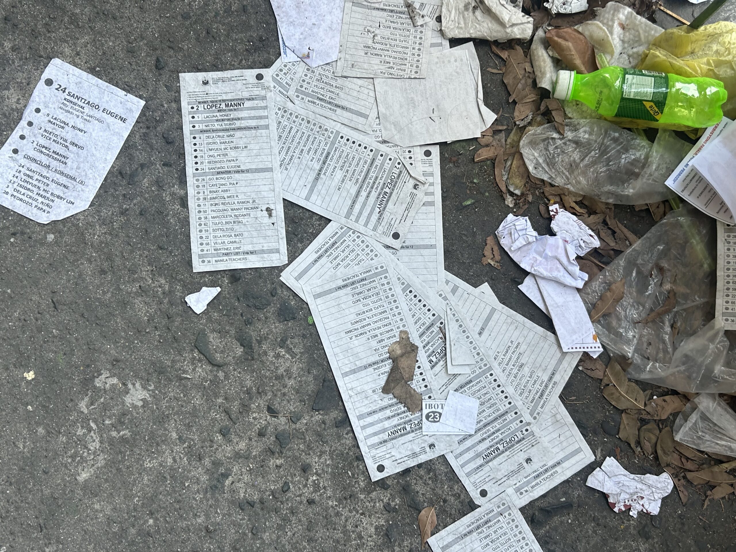 Election day violations? Sample ballots litter Manila polling places ...